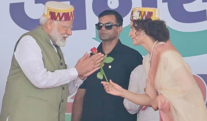 Kangana welcomes Modi with a rose